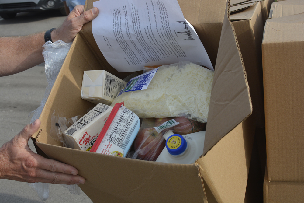 Hundreds of people come for free food boxes | Winchester Sun